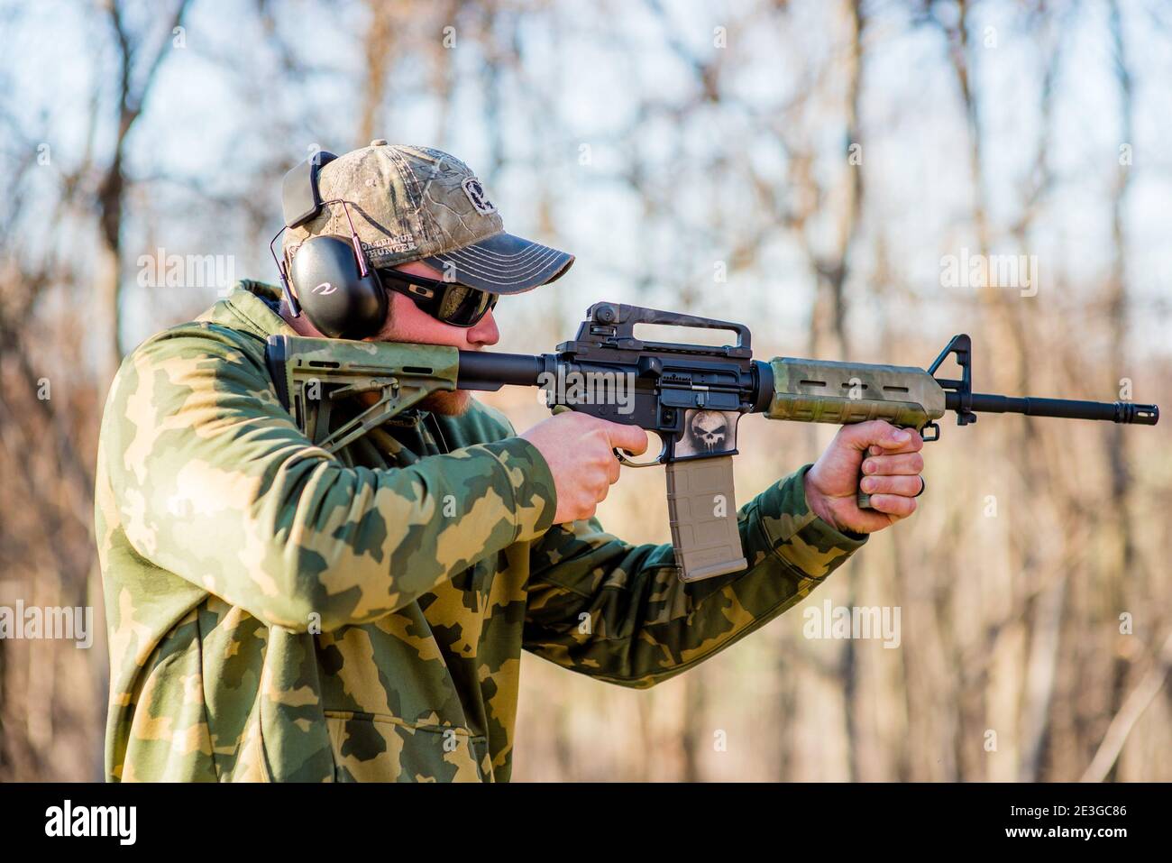 Weapon people with guns and leaves hi-res stock photography and images ...