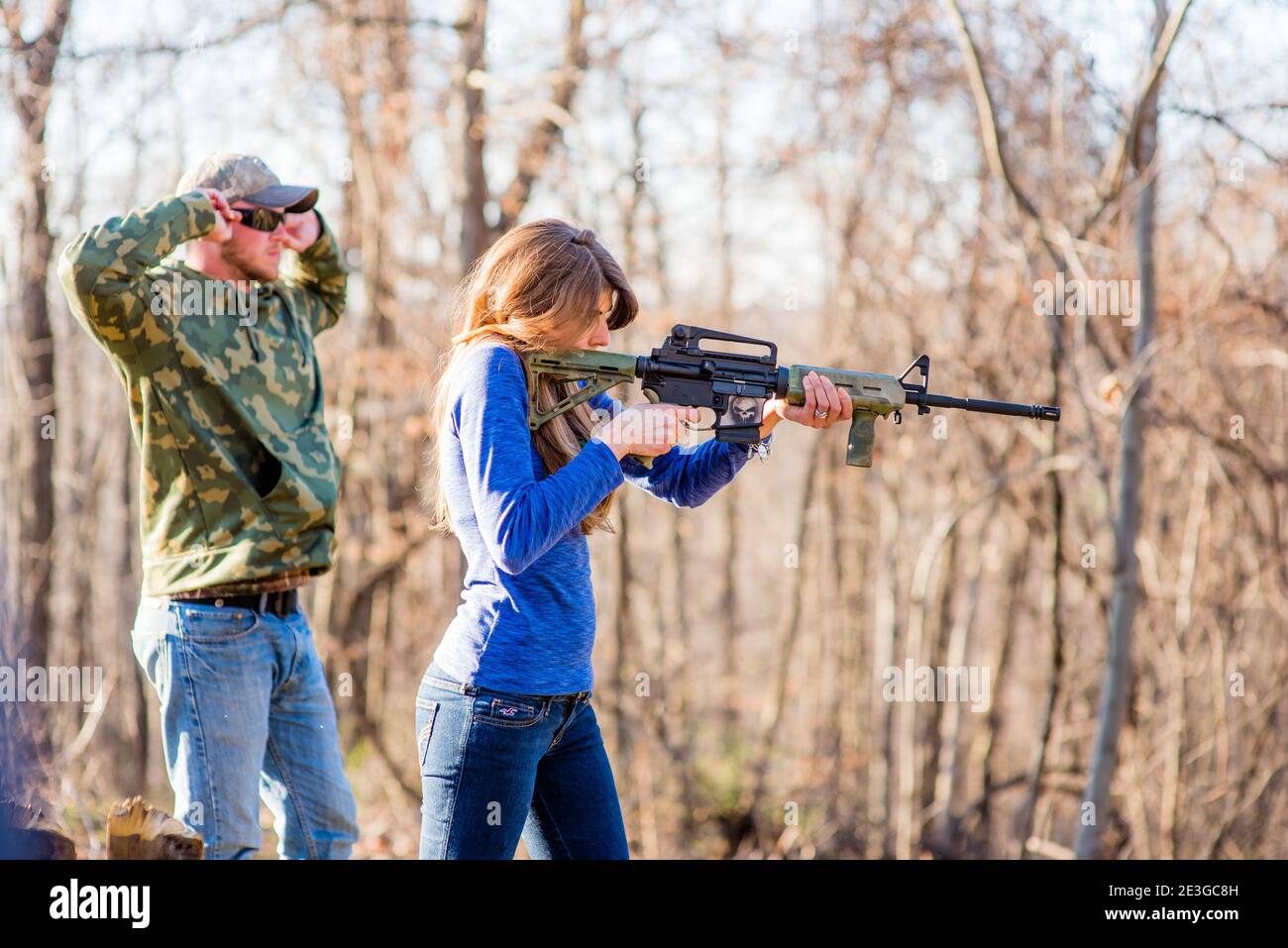 Family shooting guns practice and hanging out Stock Photo - Alamy