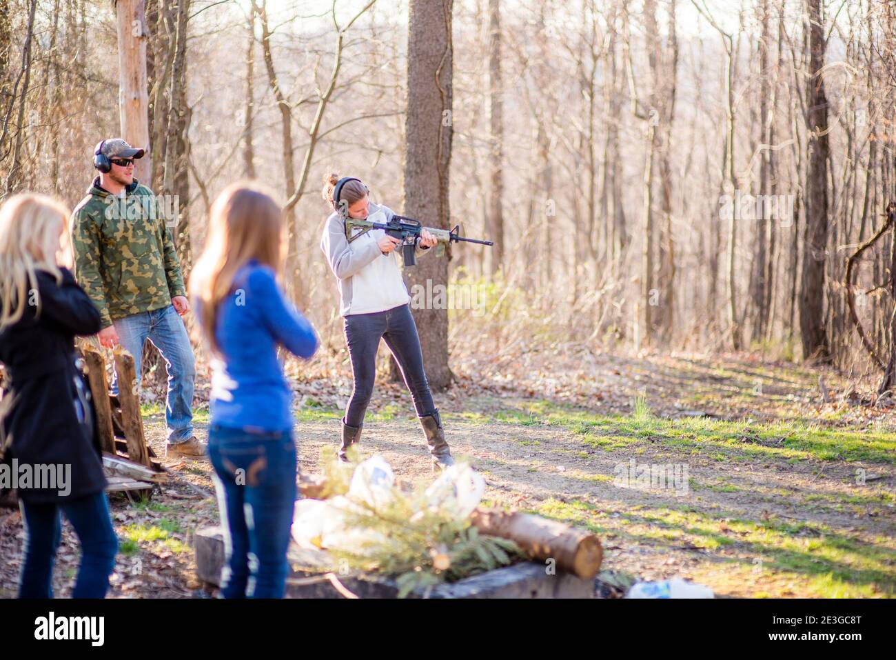 Family shooting guns practice and hanging out Stock Photo - Alamy
