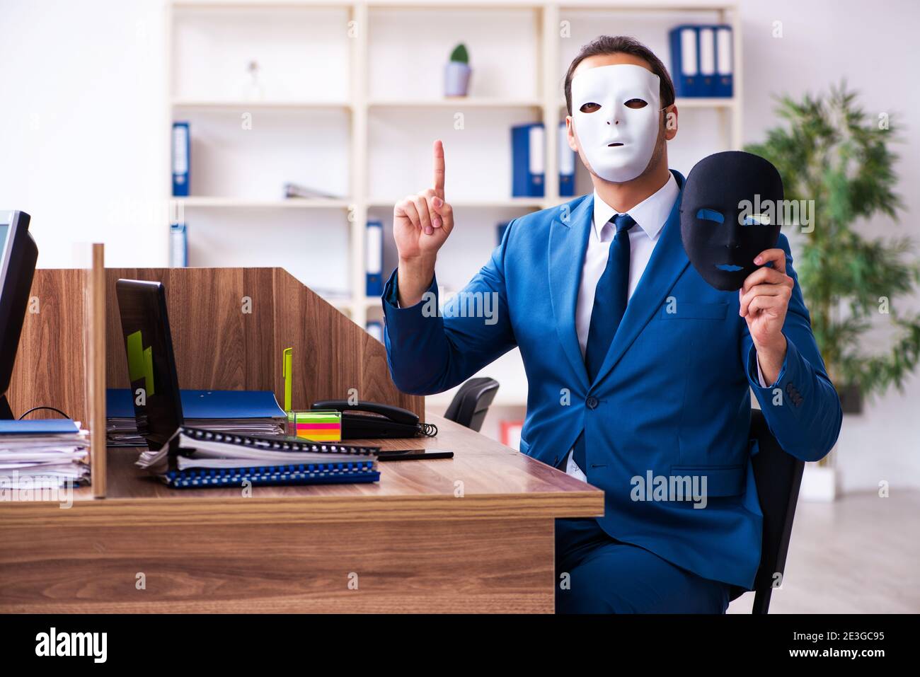 Young employee wearing mask in the office Stock Photo - Alamy
