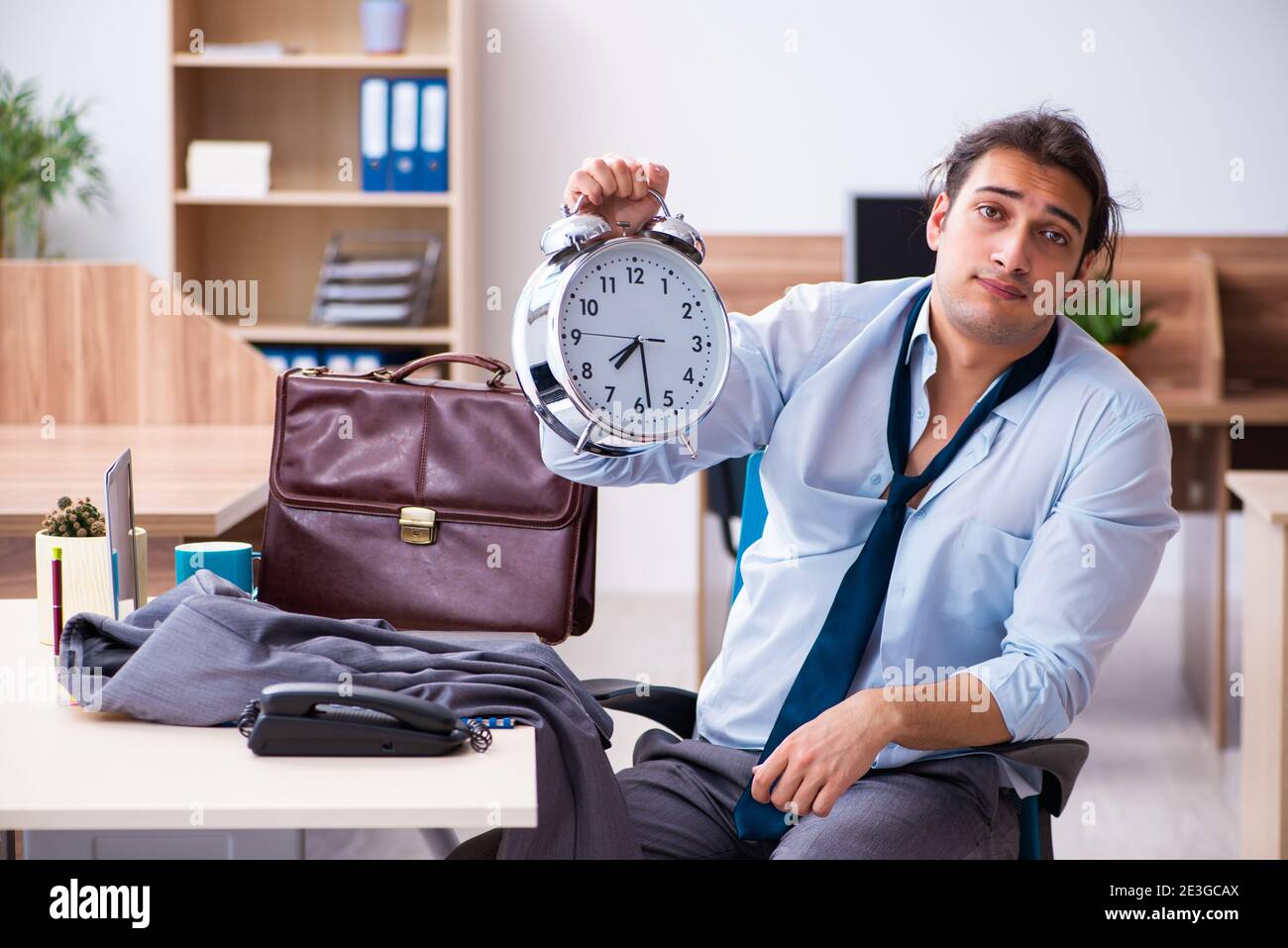 Male employee being late for his job Stock Photo - Alamy