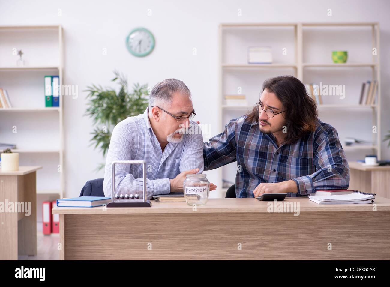 Two employees in the retirement concept Stock Photo - Alamy