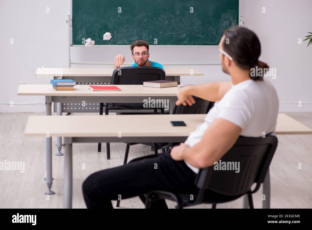 Boys fighting classroom hi-res stock photography and images - Alamy