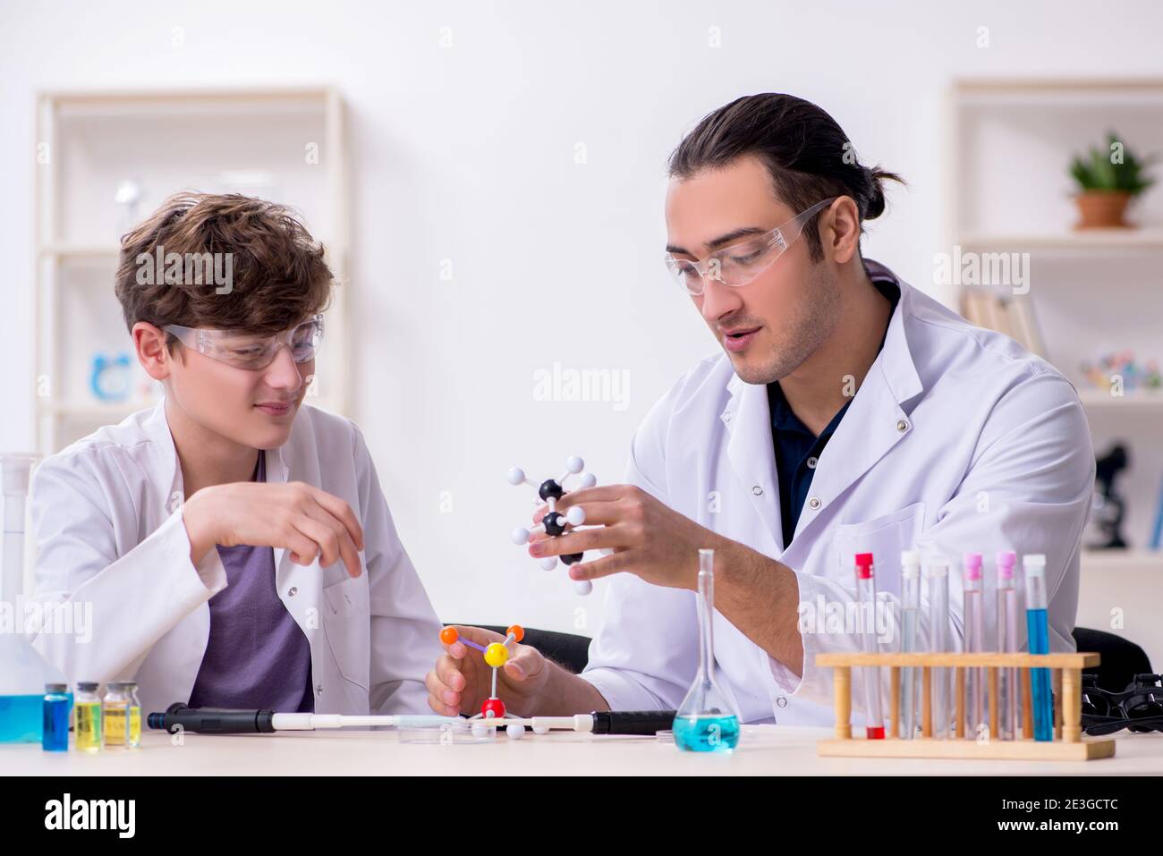 Young father and son chemists in the laboratory Stock Photo - Alamy
