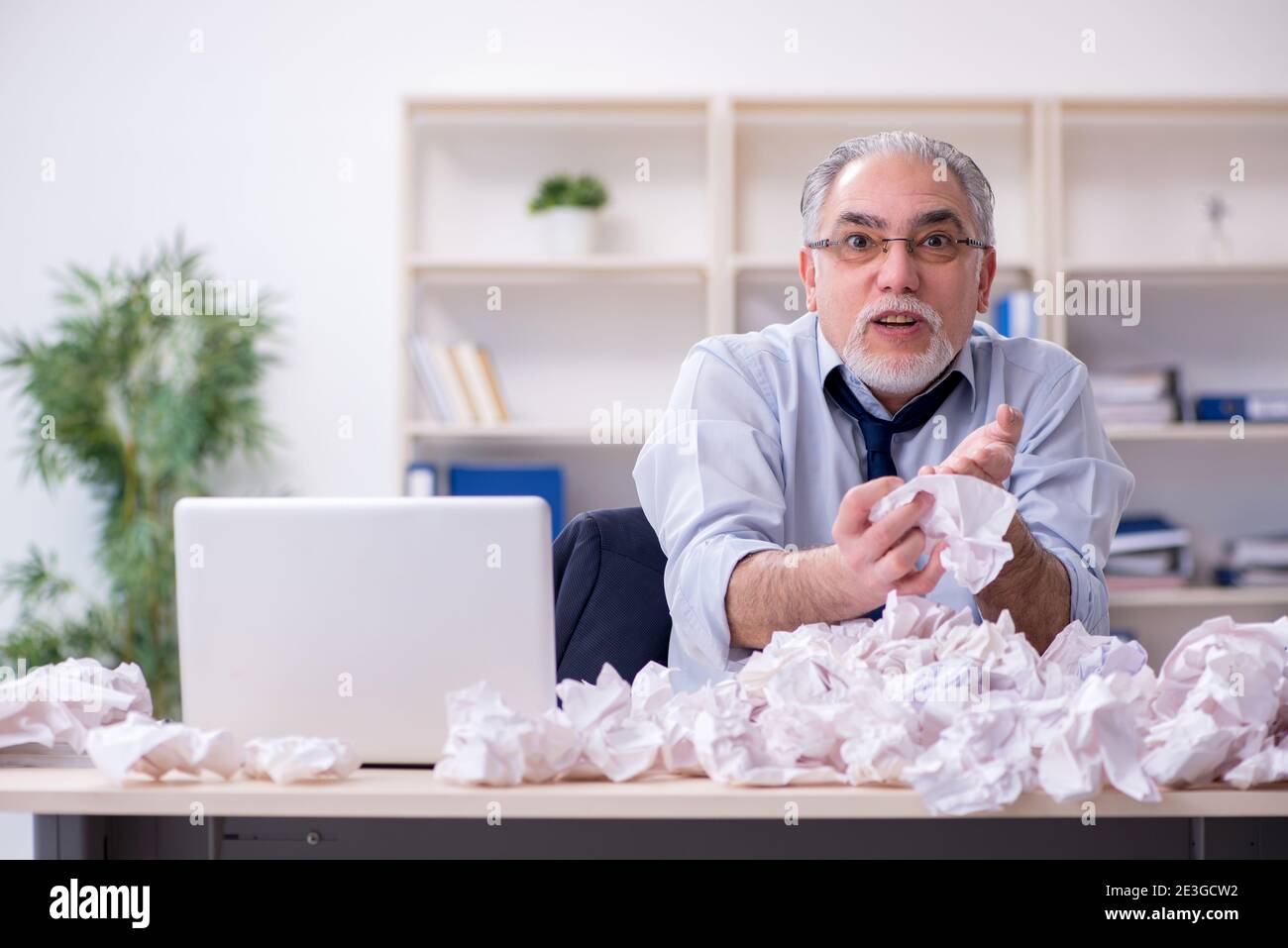 Old businessman rejecting ideas with lots of papers Stock Photo - Alamy