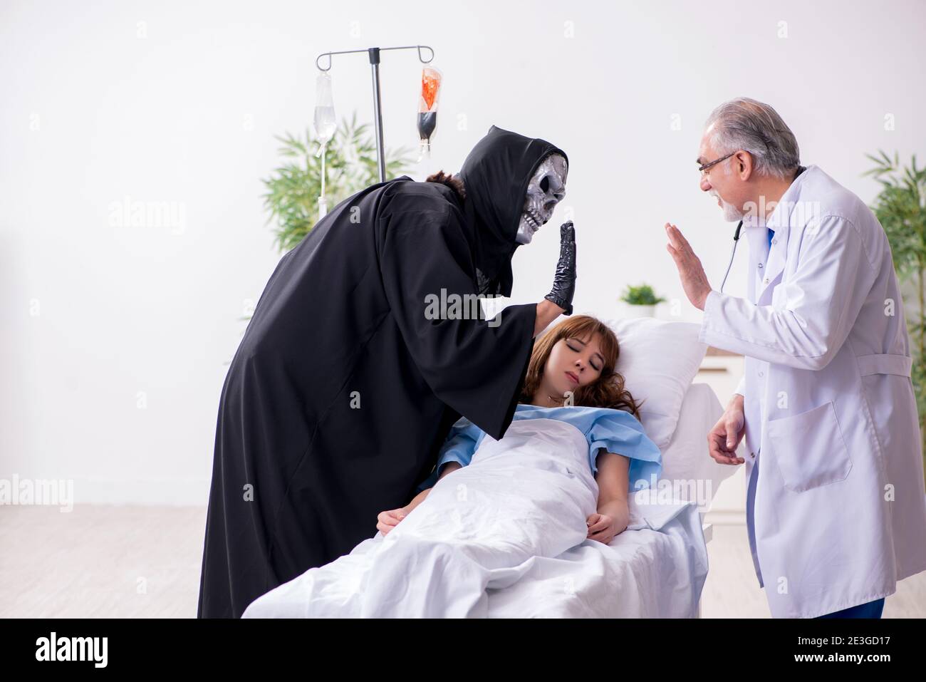 Devil, old doctor and female patient in clinic Stock Photo - Alamy