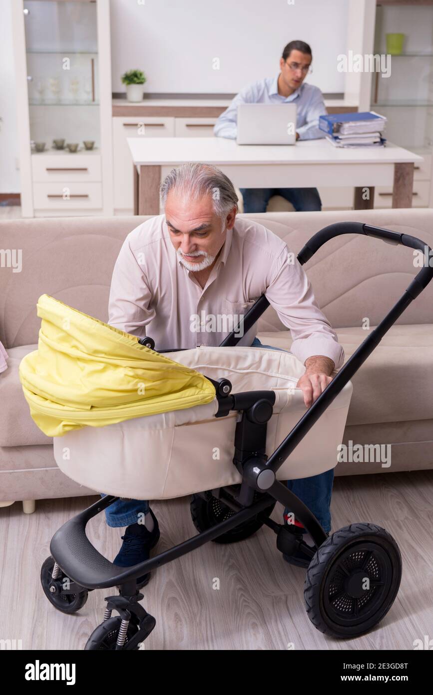 Grandparent looking after infant hi-res stock photography and images ...