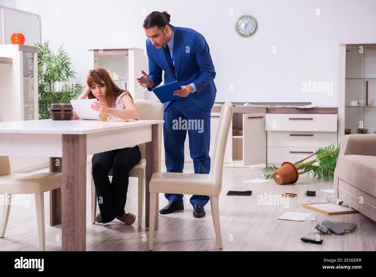 Female owner and police officer in housebreaking concept Stock Photo ...