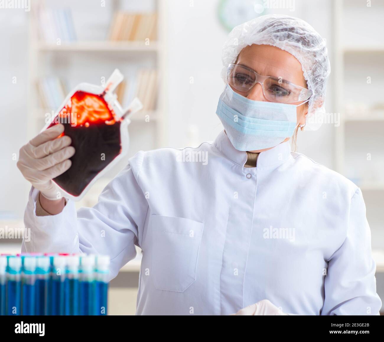 The woman doctor checking blood samples in lab Stock Photo - Alamy
