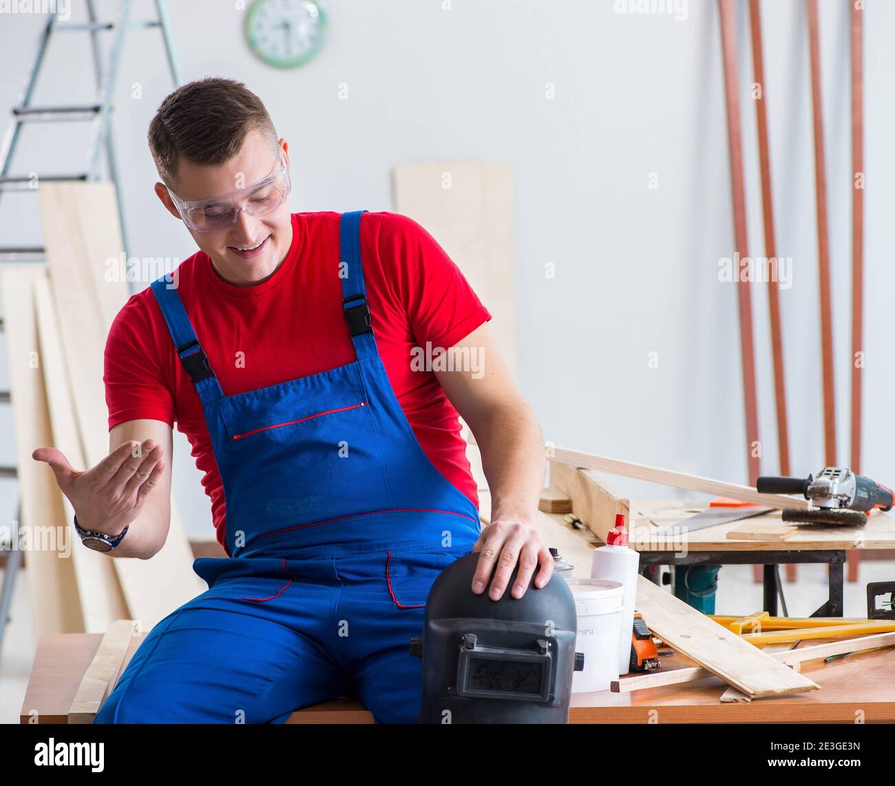 The contractor working in the workshop Stock Photo - Alamy
