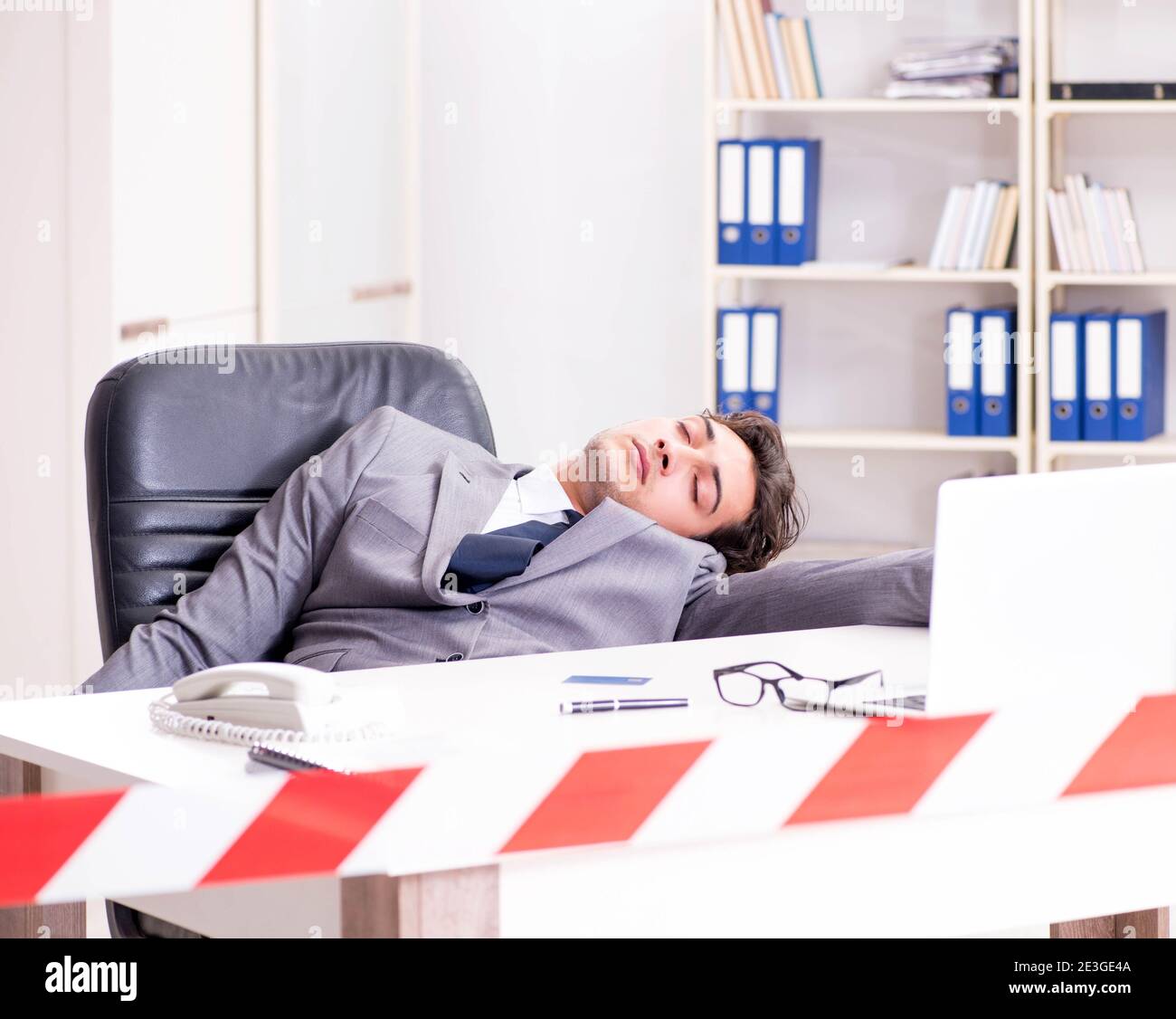 The dead businessman at this desk Stock Photo - Alamy