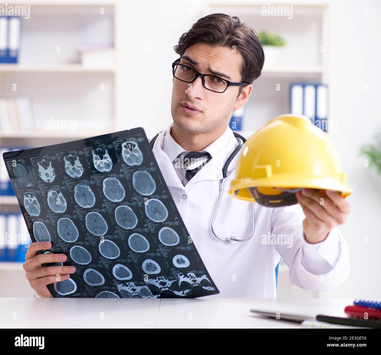 The safety doctor advising about wearing hard hat Stock Photo - Alamy