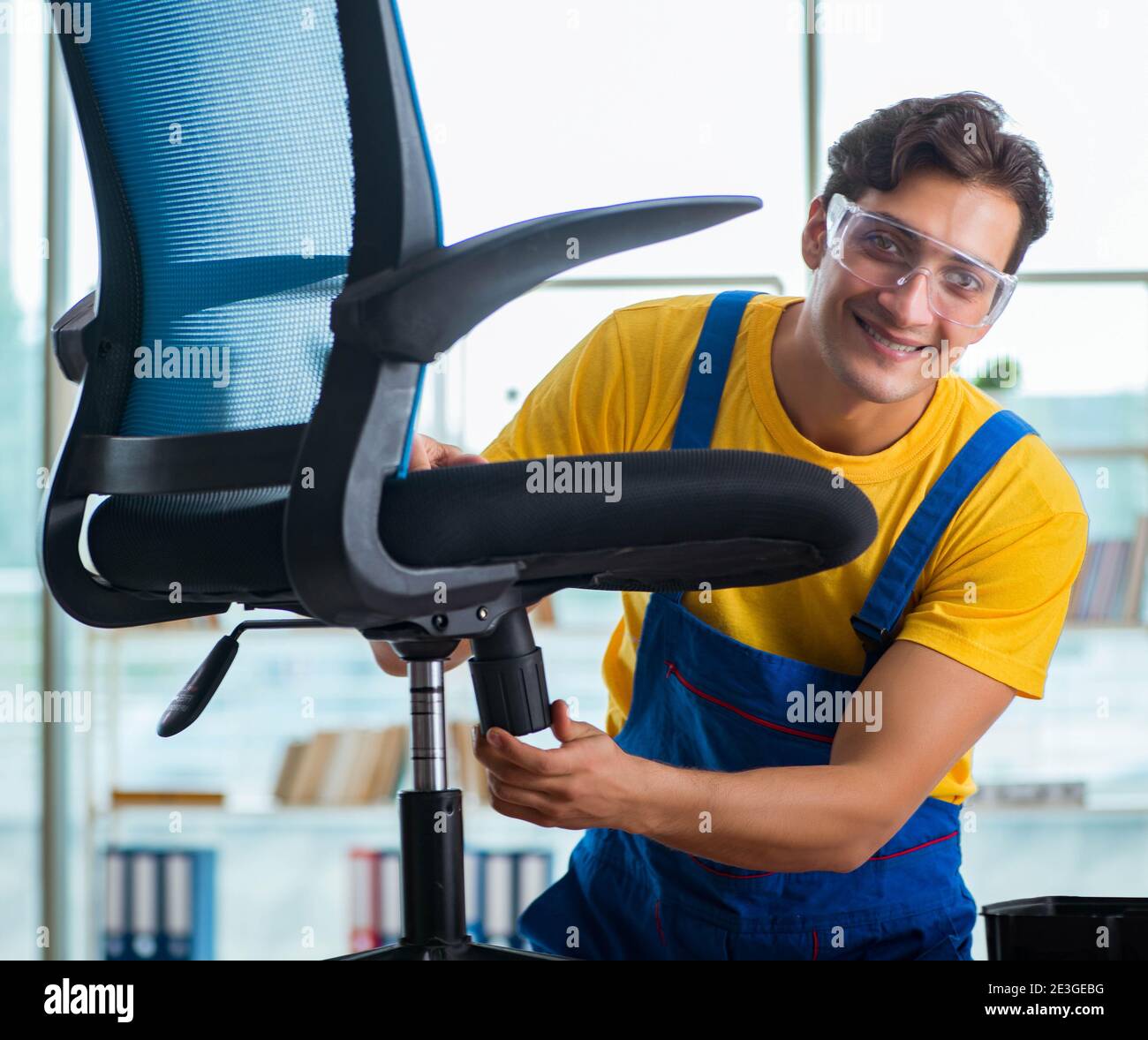 The furniture repairman working on repairing the chair Stock Photo - Alamy