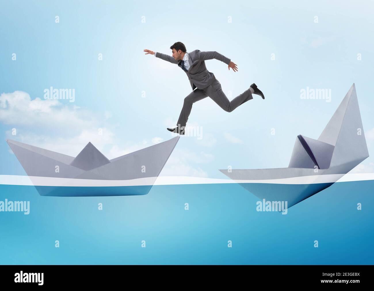 The businessman escaping sunken paper boat ship Stock Photo - Alamy