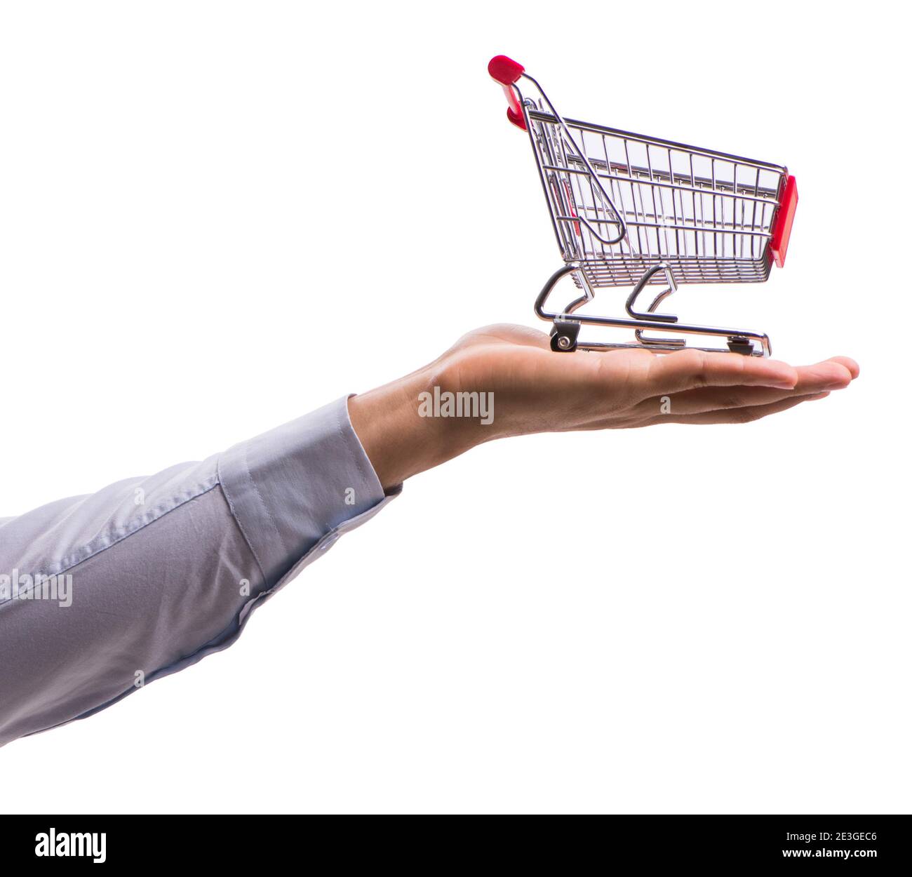 The hand holding shopping cart isolated on white Stock Photo - Alamy