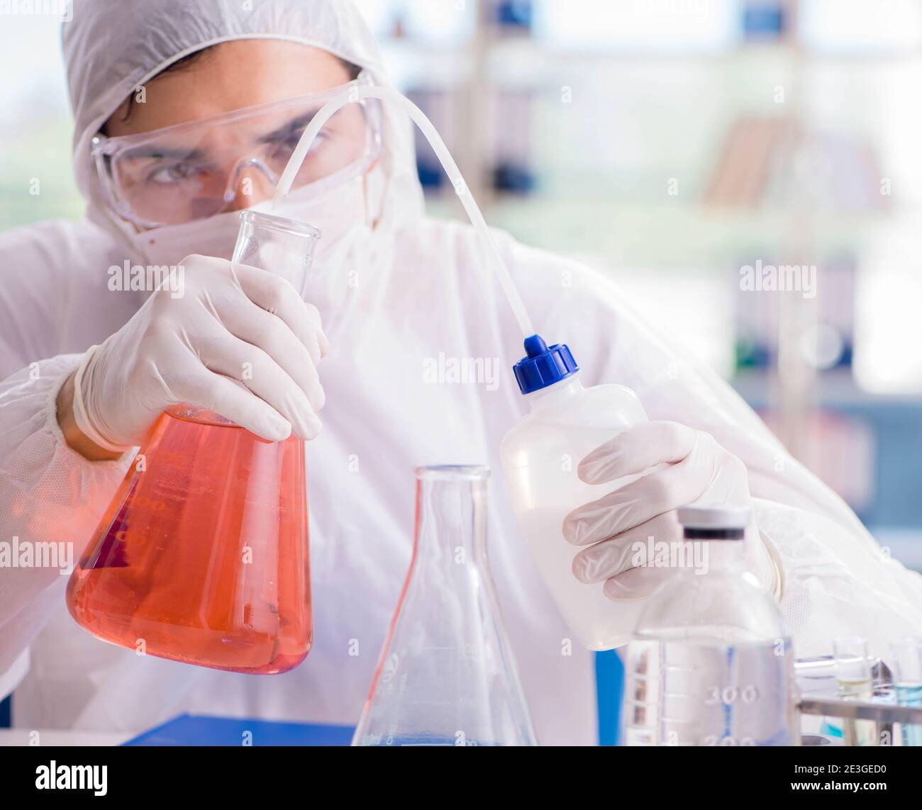 The chemist working in the laboratory with hazardous chemicals Stock ...