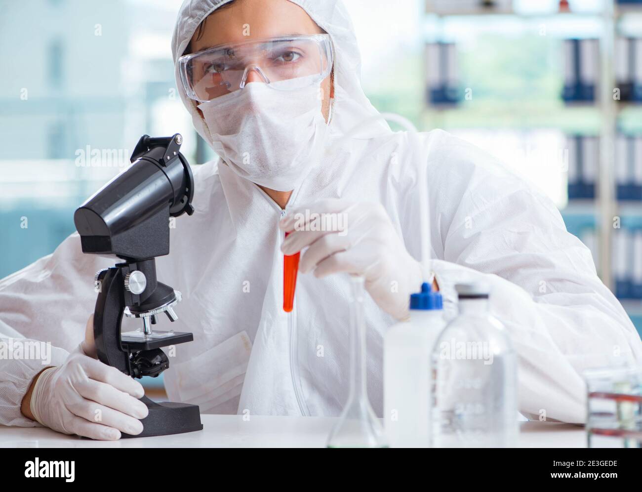 The chemist working in the laboratory with hazardous chemicals Stock ...