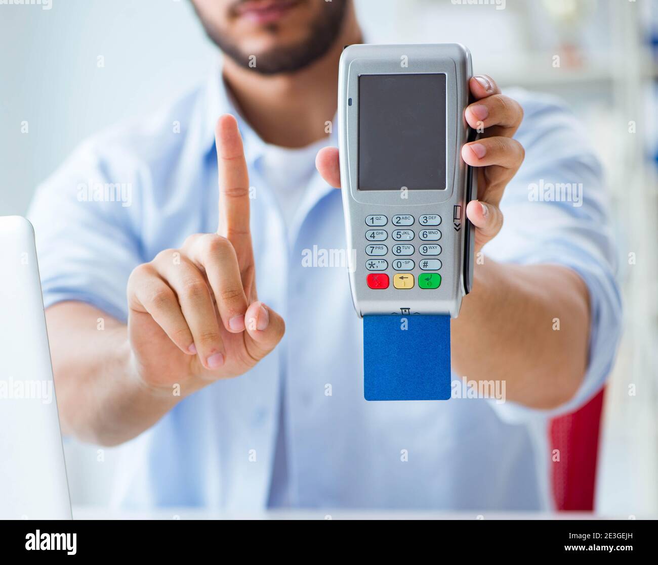 The man processing credit card transaction with pos terminal Stock ...