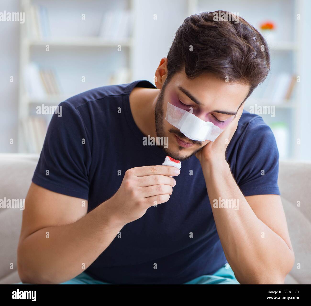Young man recovering healing at home after plastic surgery nose job ...