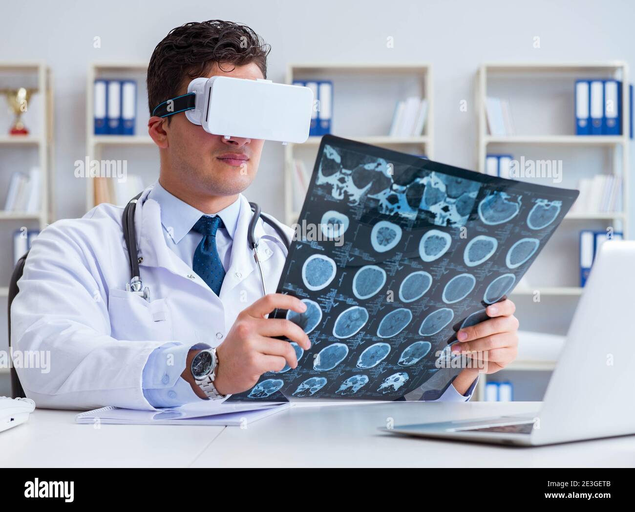 The young doctor looking at mri scan through vr glasses Stock Photo - Alamy
