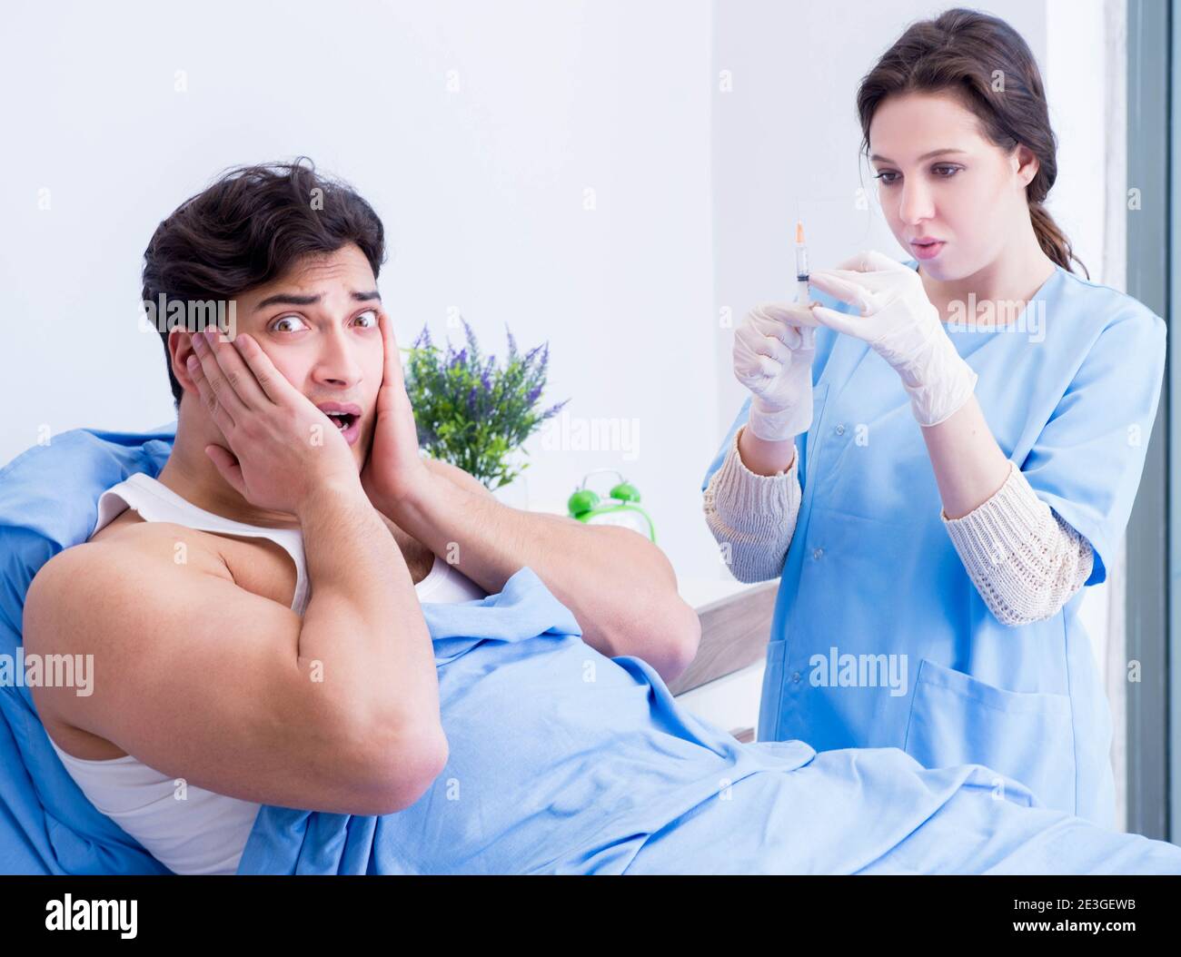 The doctor doing medical injection in hospital room Stock Photo - Alamy