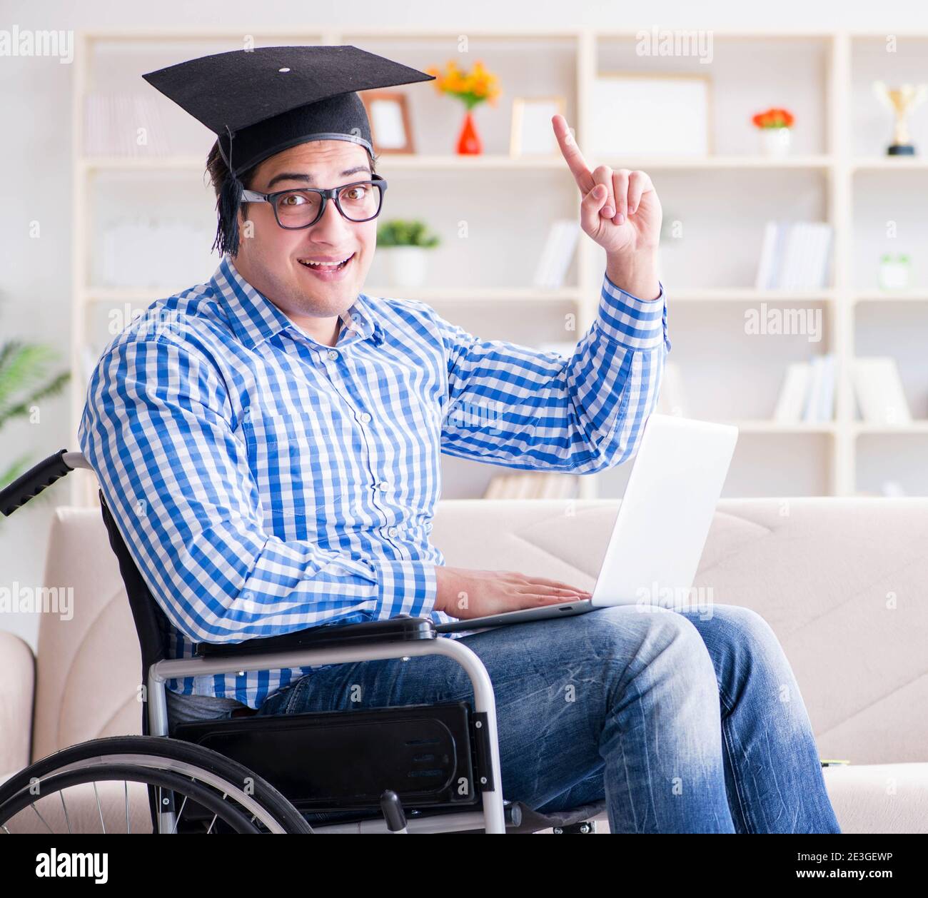 The young student on wheelchair in disability concept Stock Photo - Alamy