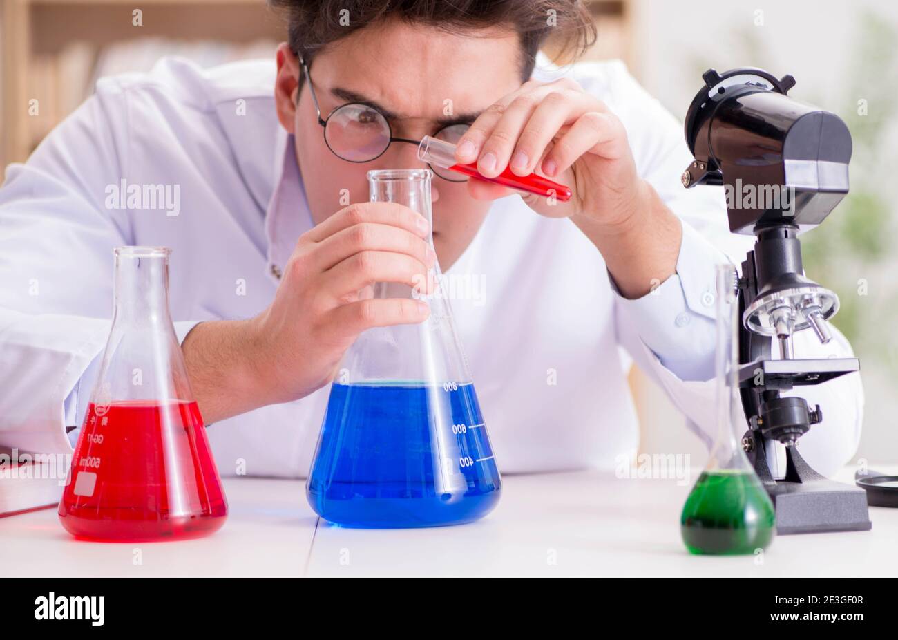 The mad crazy scientist doctor doing experiments in a laboratory Stock ...