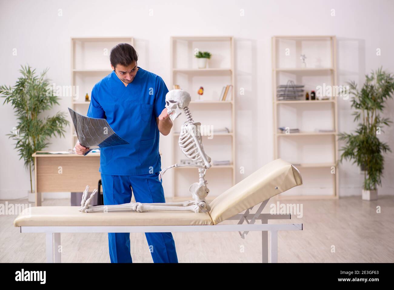 Young doctor radiologist and skeleton patient in the clinic Stock Photo ...