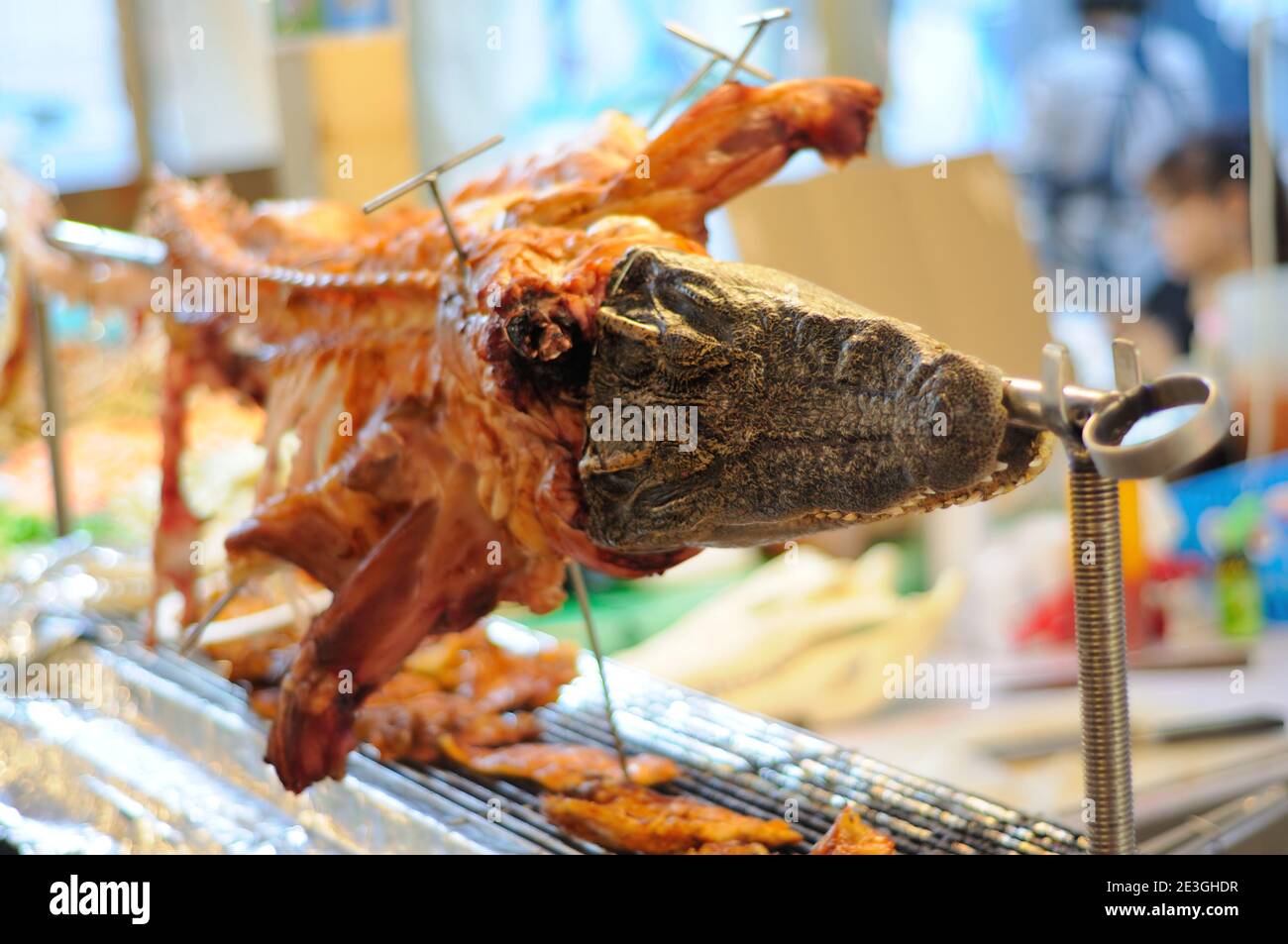 Grilled Crocodile Meat Sold in a Street Market Stock Photo - Alamy