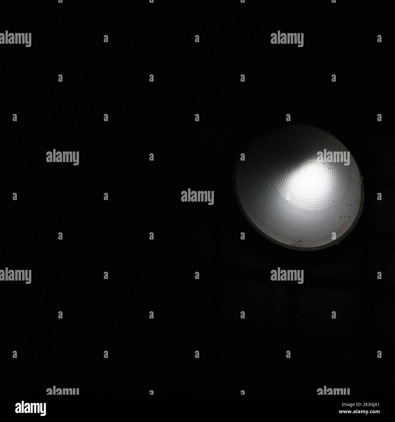 Dim light in the dark entrance of an apartment building. The concept of ...