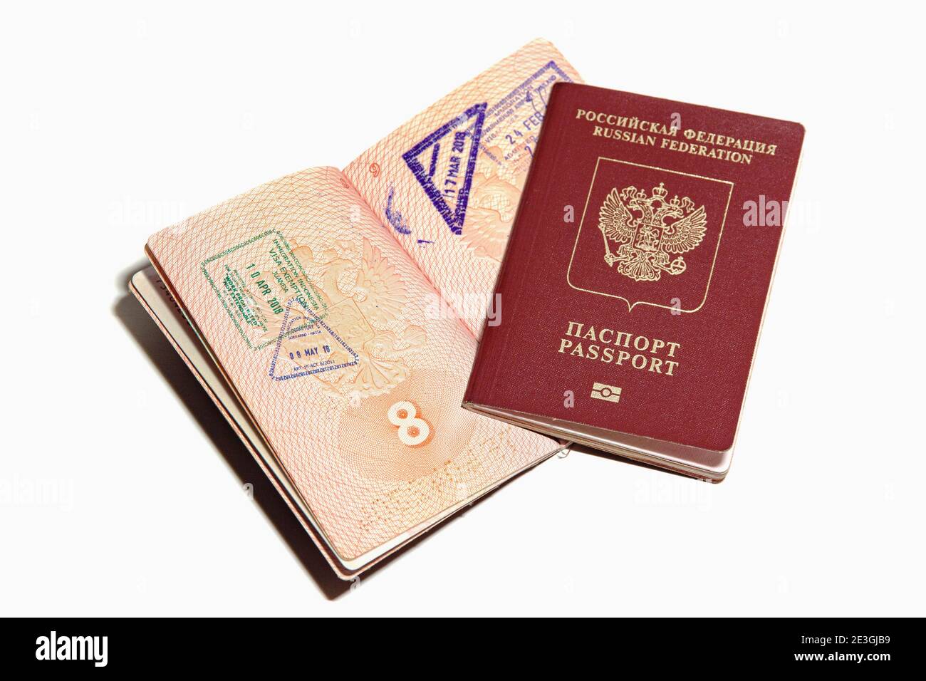 Russian travel passport with visa stamps. Isolated on a white ...