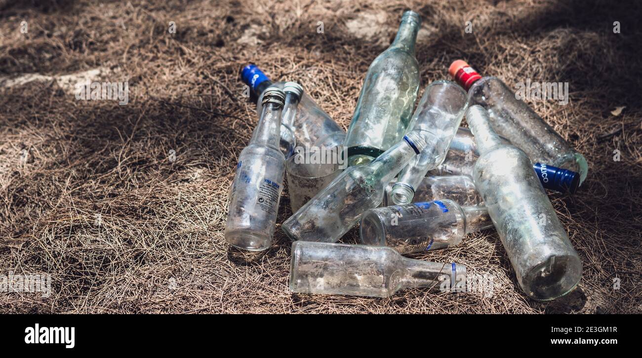 BANNER landfill old dirty transparent discarded empty glass alcohol ...