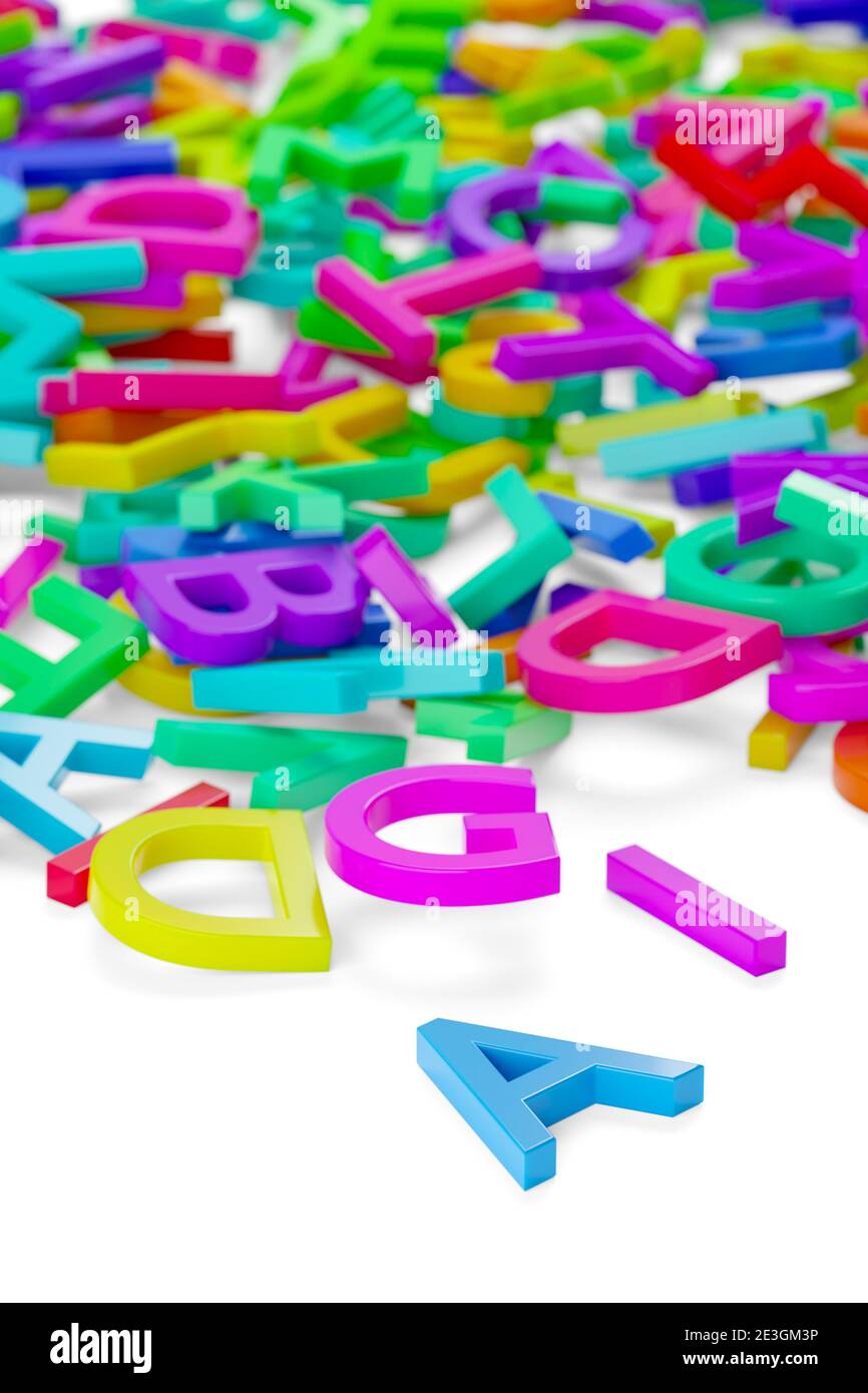Heap of colorful rainbow alphabetic plastic character letters over ...