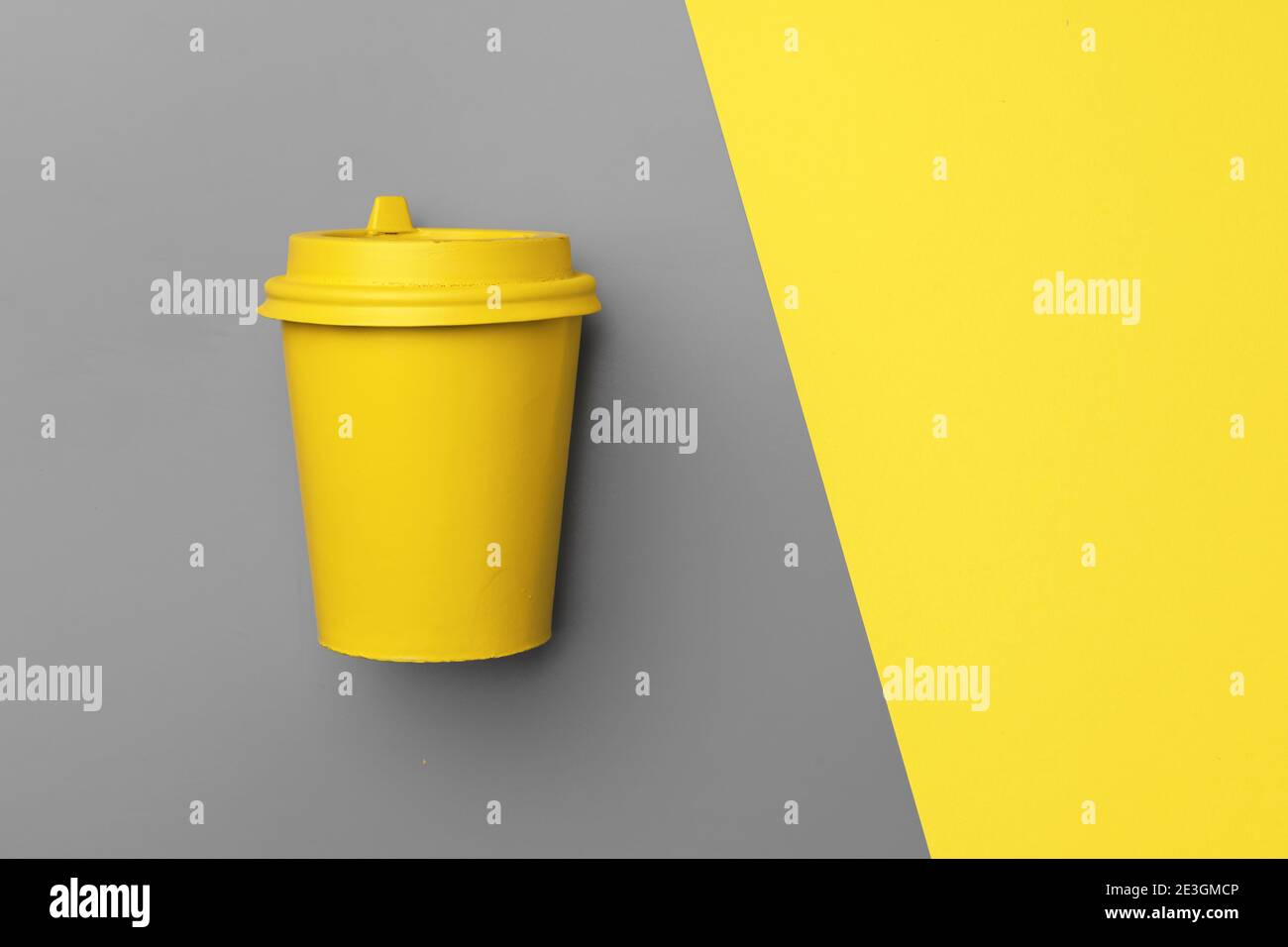Disposable coffee cup in yellow gray colors Stock Photo - Alamy