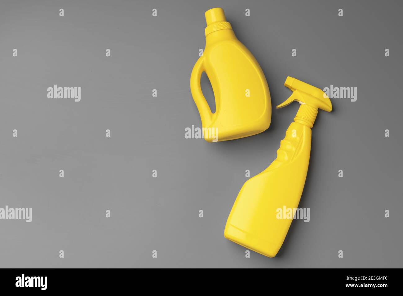 Yellow liquid detergents containers on gray background Stock Photo - Alamy