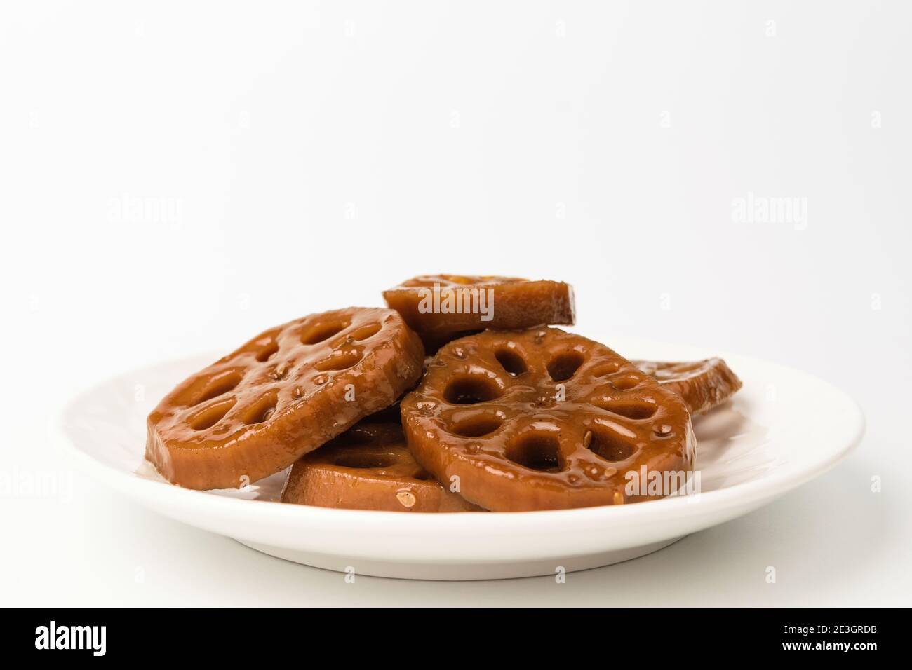 Boiled lotus root on a white background Stock Photo - Alamy