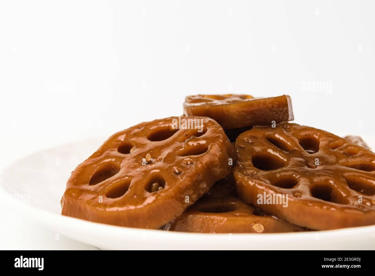 Boiled lotus root on a white background Stock Photo - Alamy