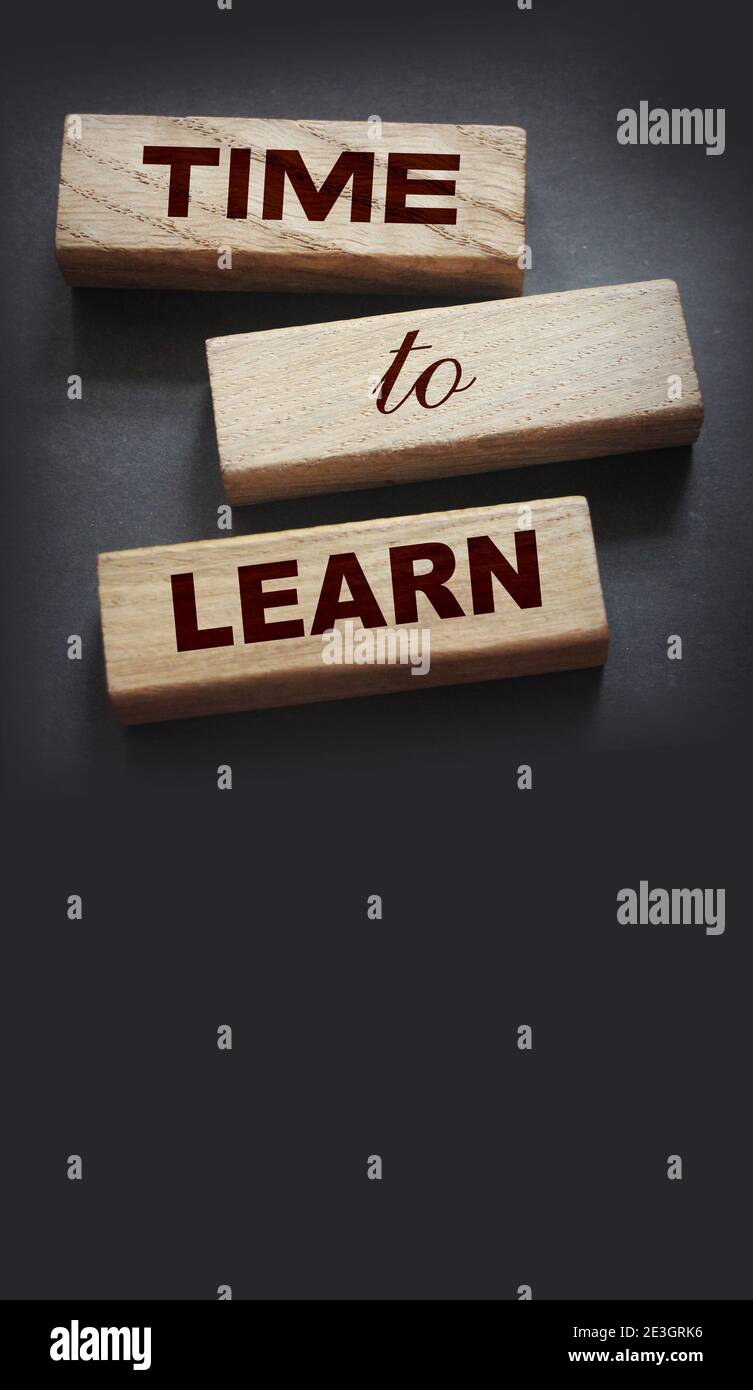 Time to Learn on wooden blocks put black. Education concept. Life-time ...
