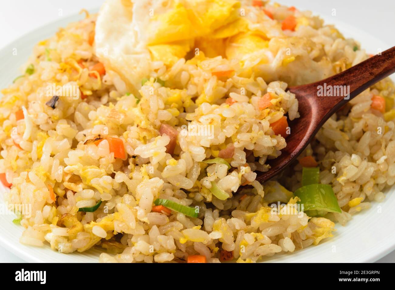 Seasoned fried rice on white background Stock Photo - Alamy