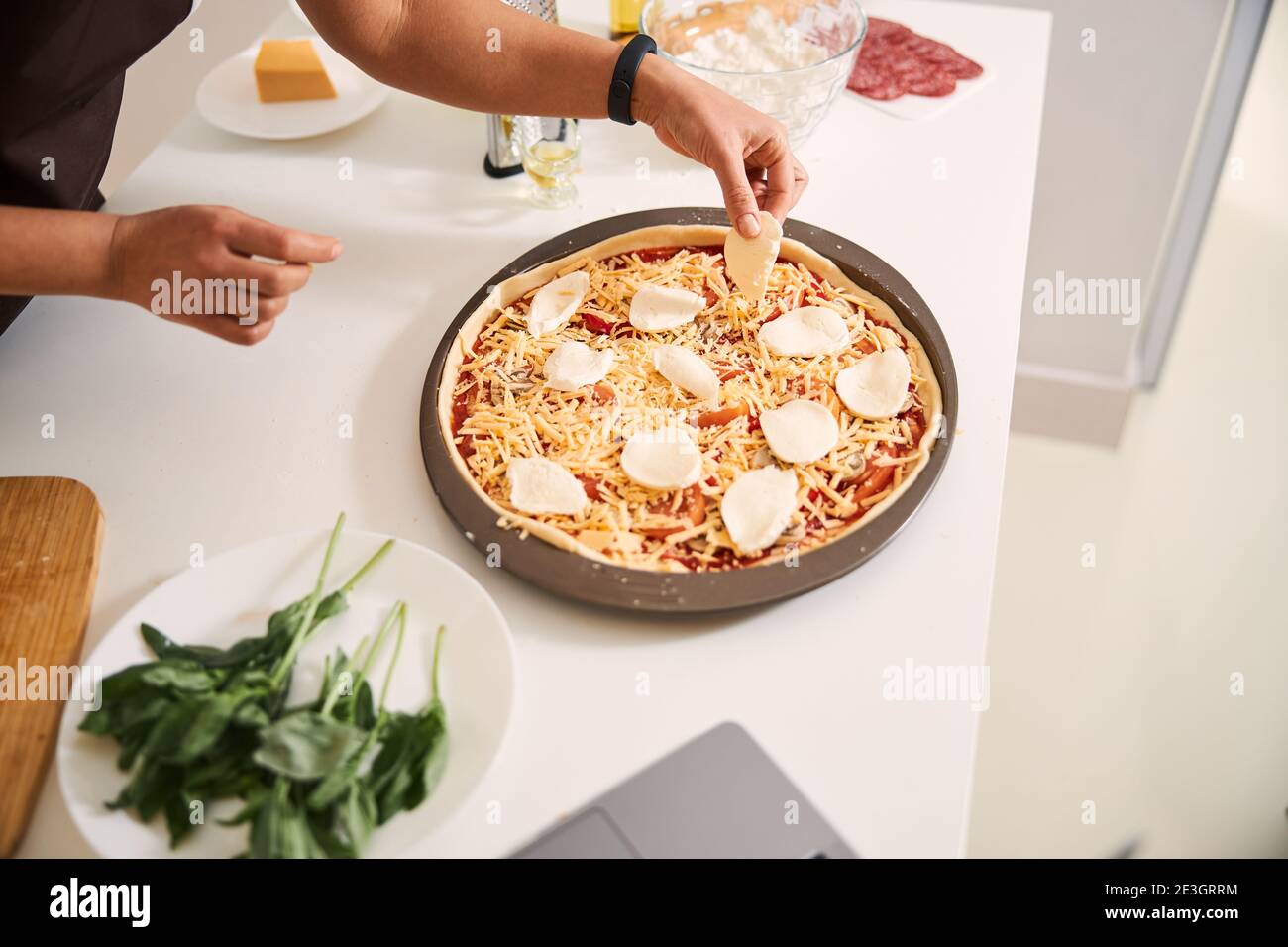 Adding mozzarella cheese italian pizza hi-res stock photography and ...