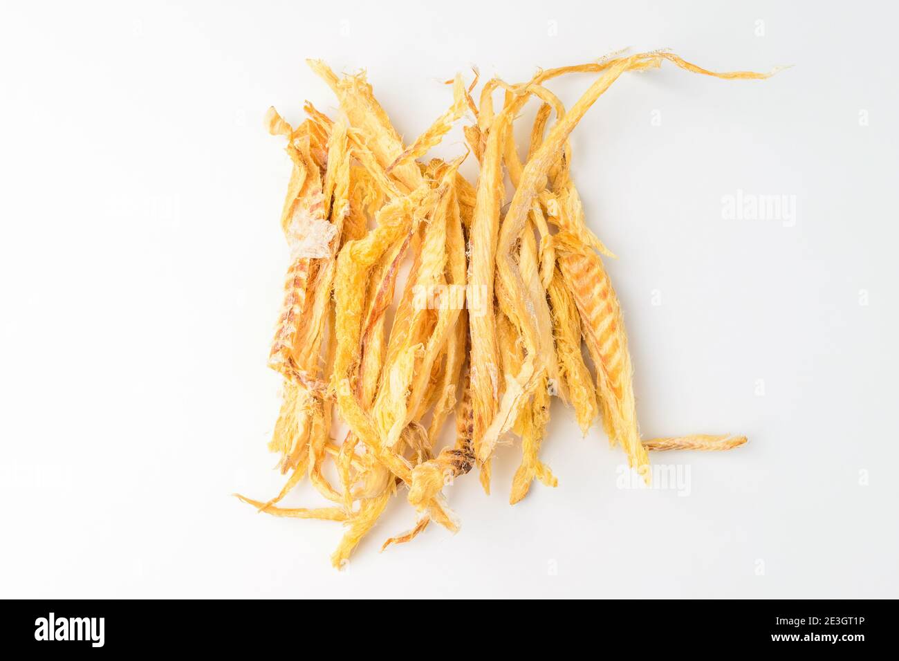 Dried pollack on white background Stock Photo - Alamy