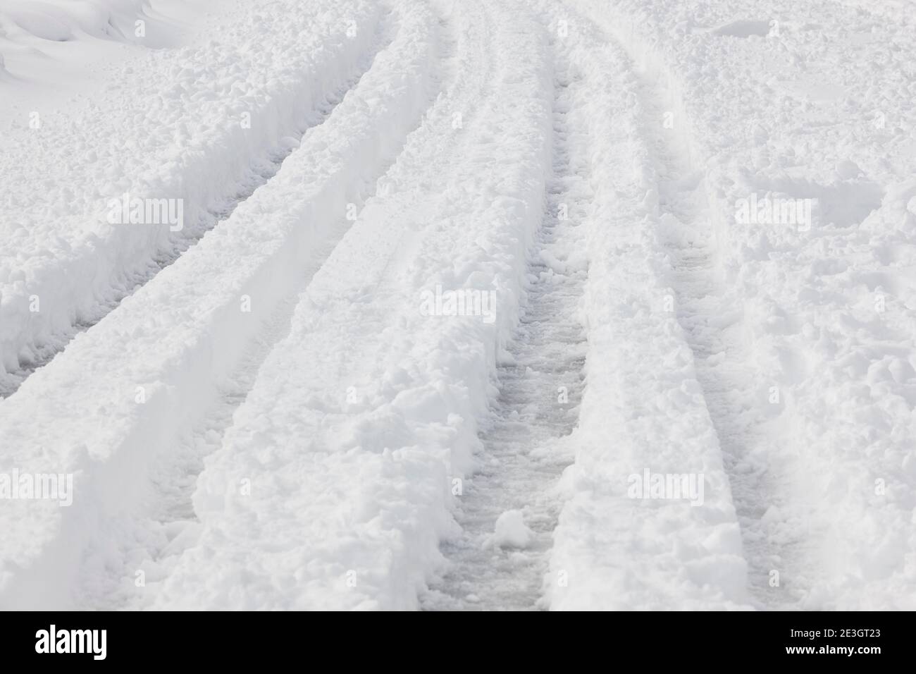 Vehicle ruts in the snow. Frozen road. Off-road drive Stock Photo - Alamy