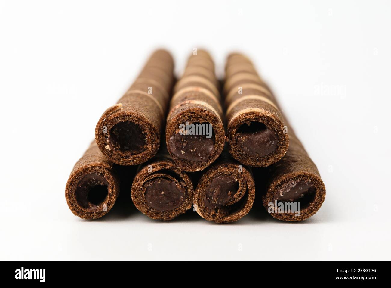 Chocolate wafer rolls on a white background Stock Photo - Alamy