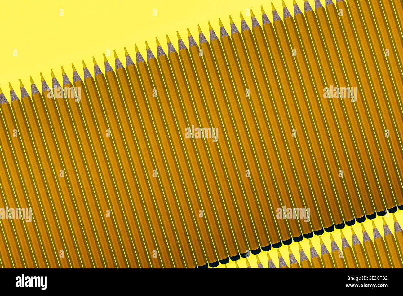 Pattern of dark yellow pencils at yellow background Stock Photo - Alamy