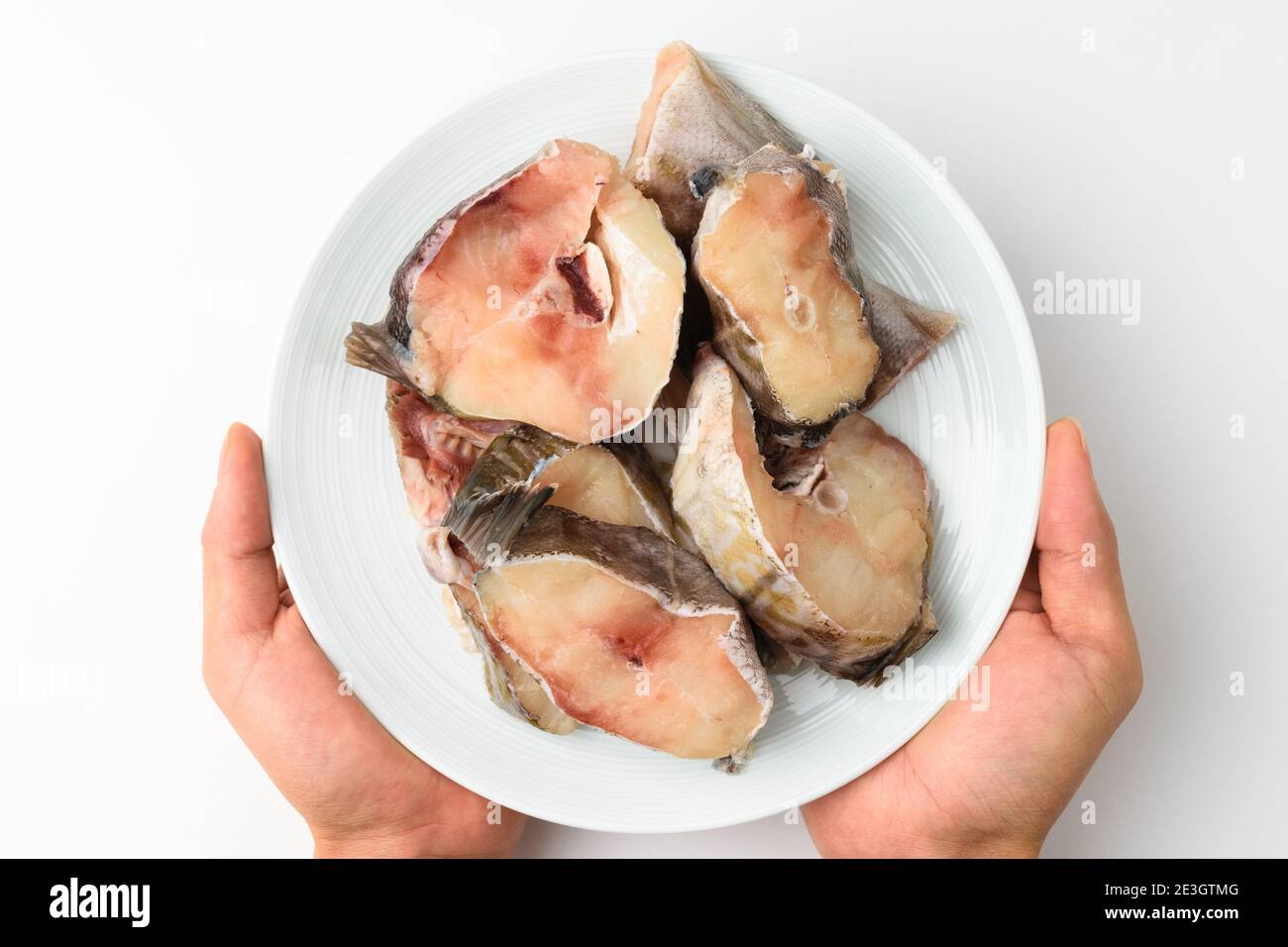 Cod fish on a white background Stock Photo - Alamy