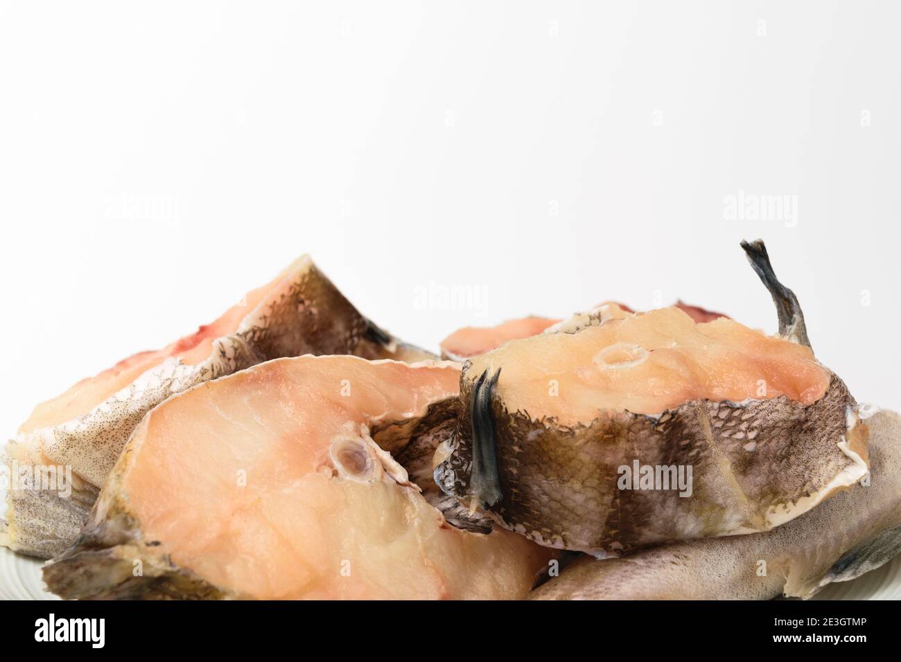 Cod fish on a white background Stock Photo - Alamy