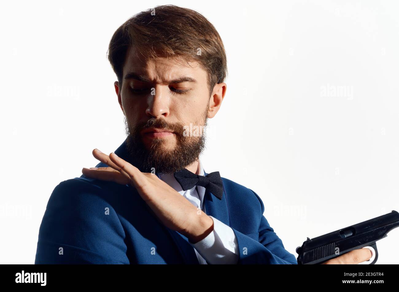 man in a suit holding a pistol lifestyle gangster Mafia close-up Stock ...