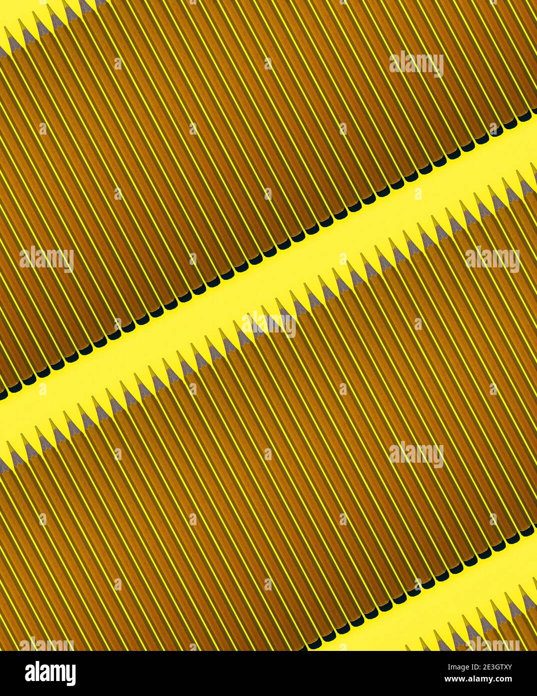 Pattern of dark yellow pencils at yellow background Stock Photo - Alamy