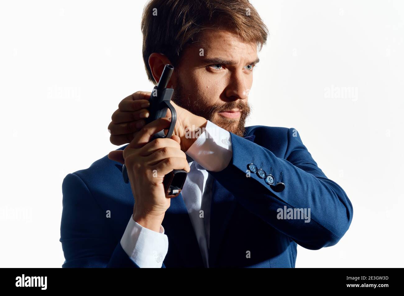 man in suit holding a gun detective crime isolated background Stock ...