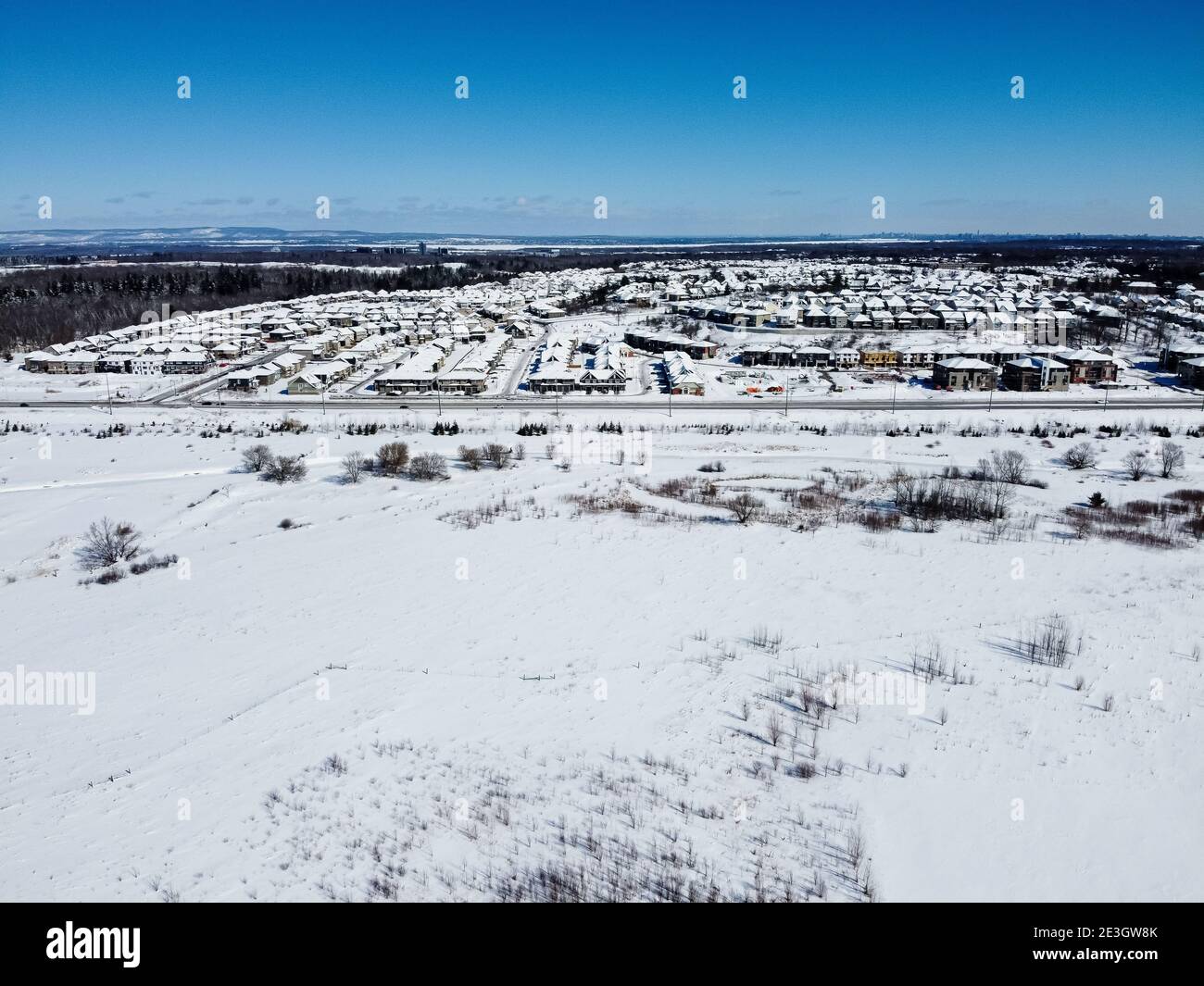Aerial of the Kanata neighborhood in winter. Suburbian houses next to a ...